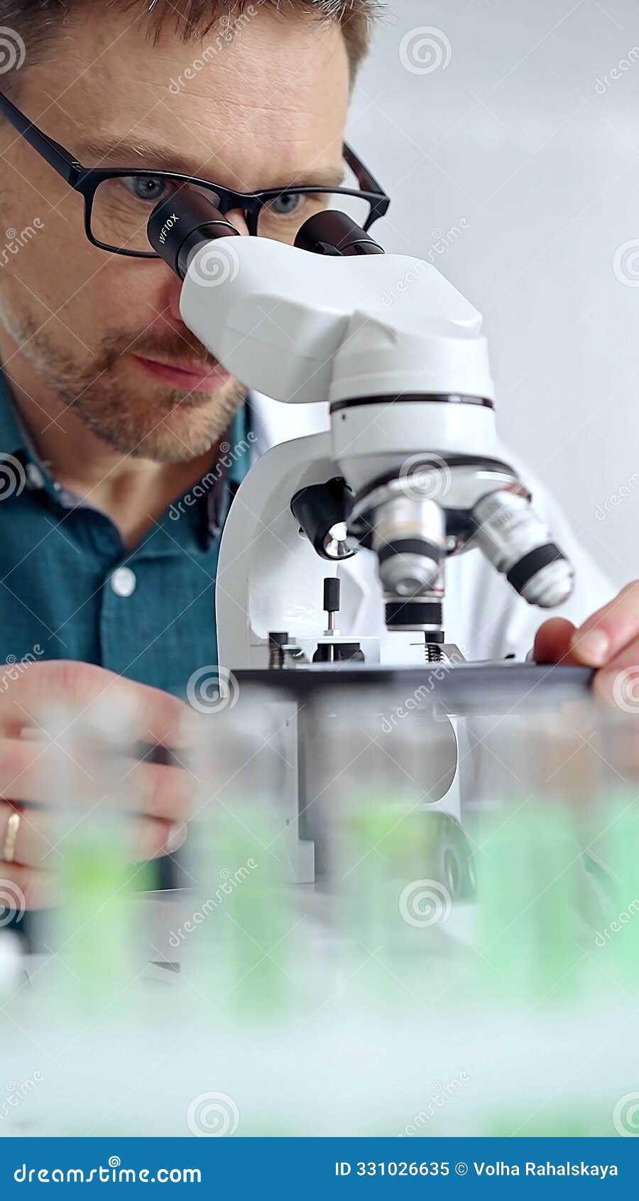 Man Scientist Using Microscope in Laboratory. Microbiology Science ...