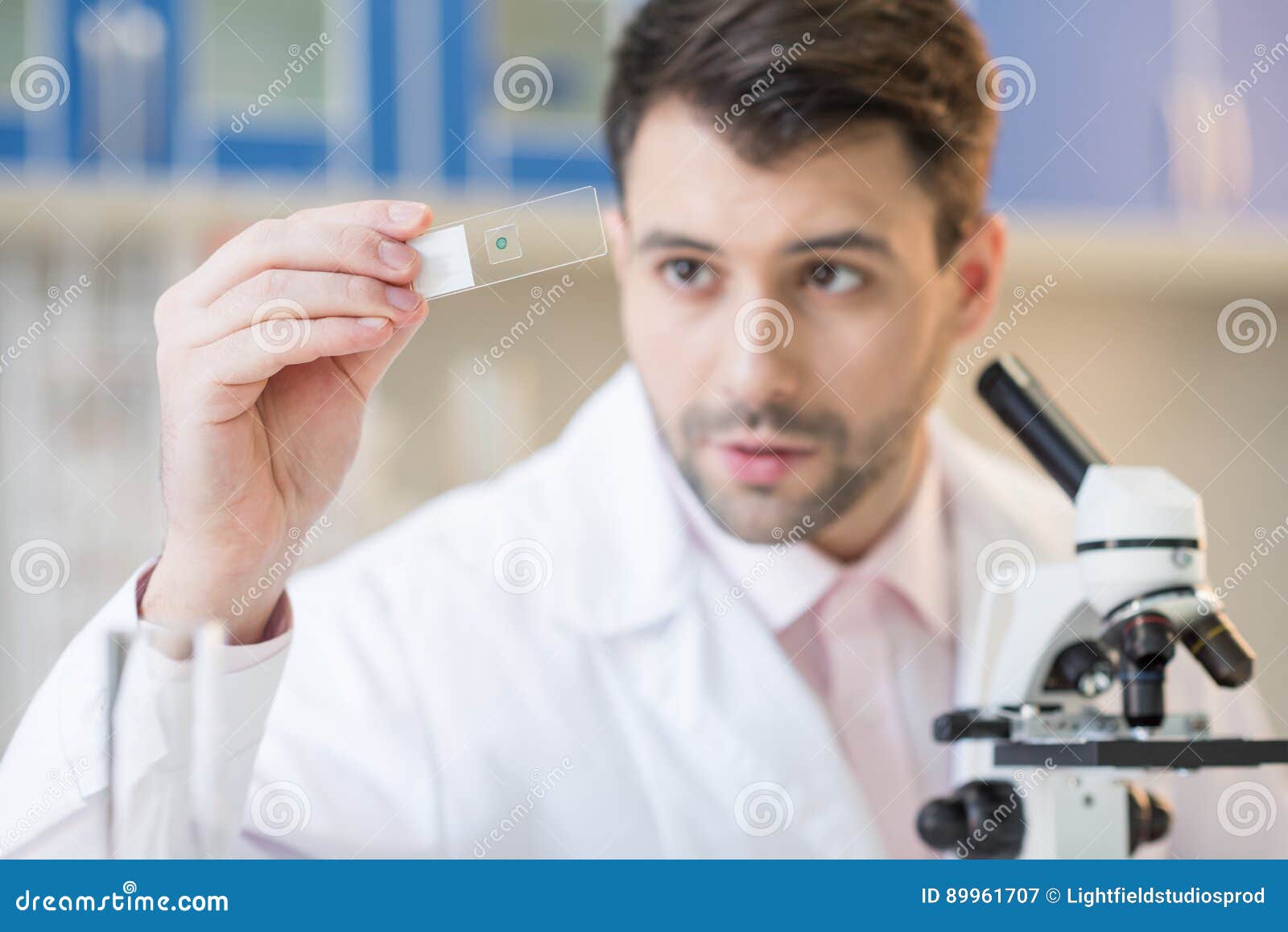 Man Scientist in White Coat Looking at Glass Microscope Slide Stock ...