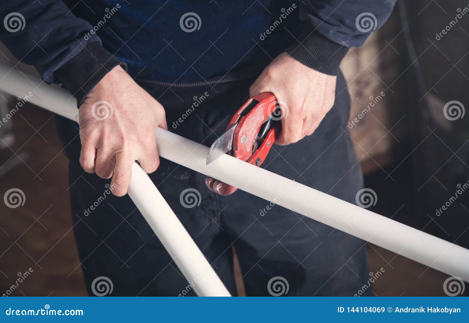 Man with Scissors Cutting Plastic Pipe Stock Image - Image of pipeline ...