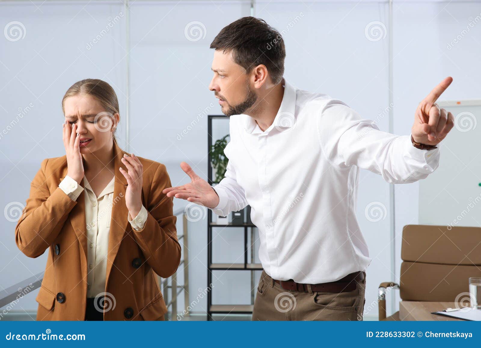 Man Scolding Woman in Office. Toxic Work Environment Stock Photo ...