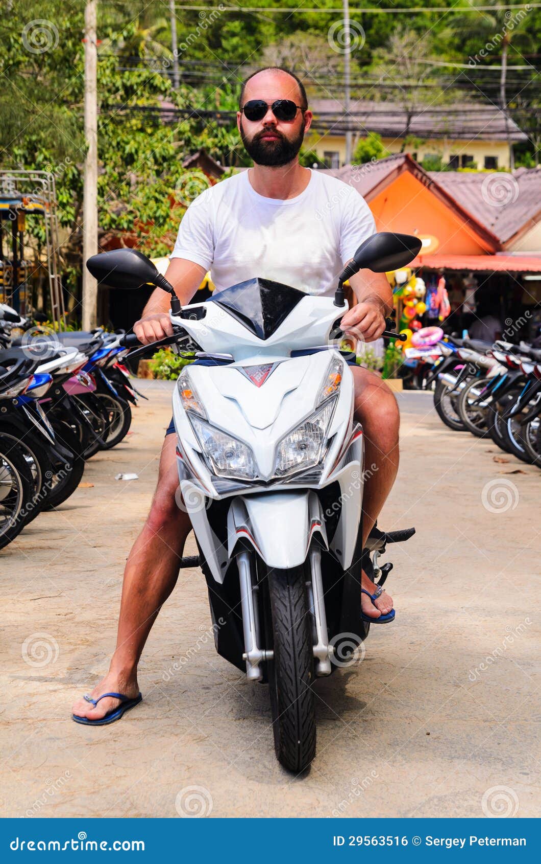Man on scooter stock photo. Image of motorbike, motorcycle - 29563516