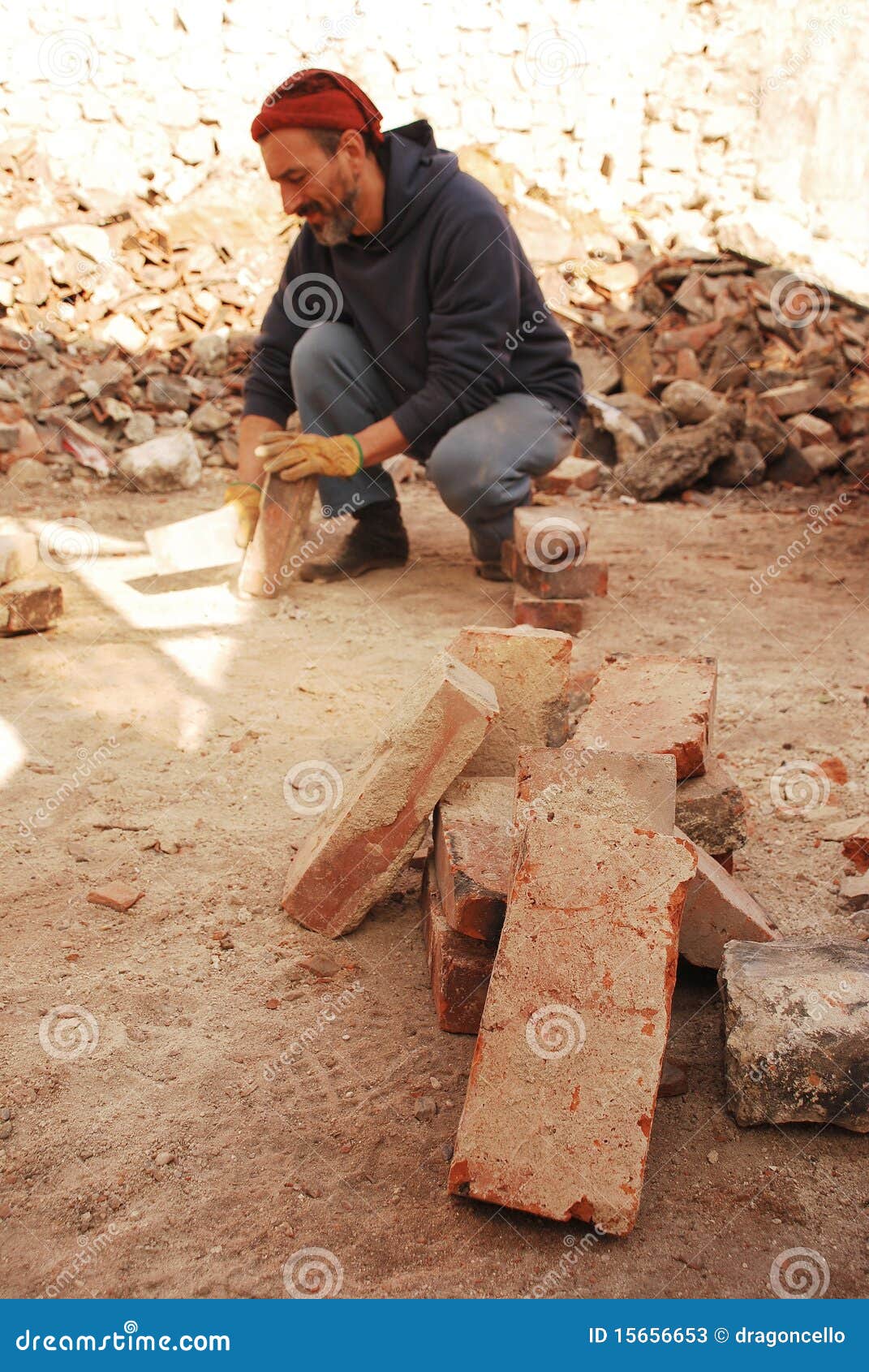 Man Scraping Bricks stock image. Image of forties, salvaged - 15656653
