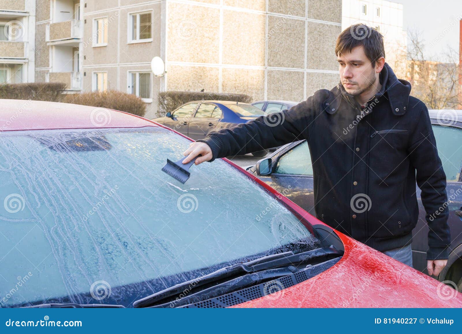 Man is Scraping Ice from Frozen Windshield Window of Car in Winter ...