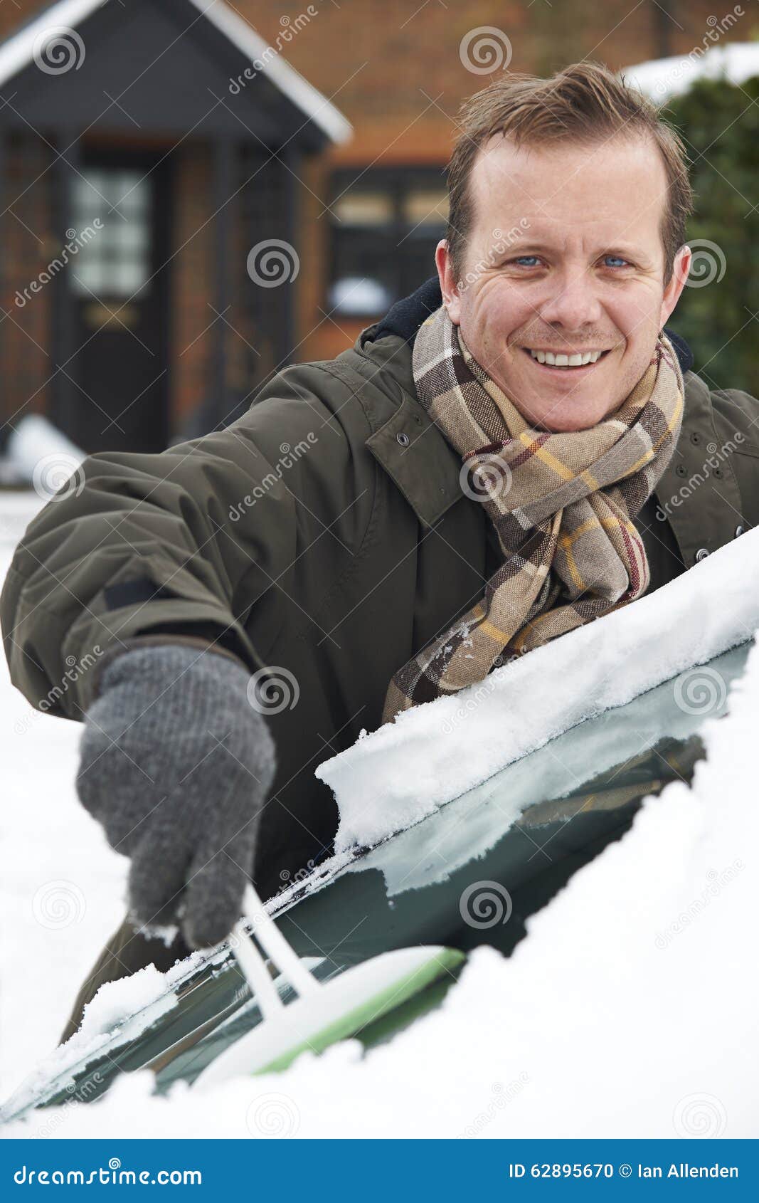 Man Scraping Snow from Car Windscreen Stock Photo - Image of outdoors ...