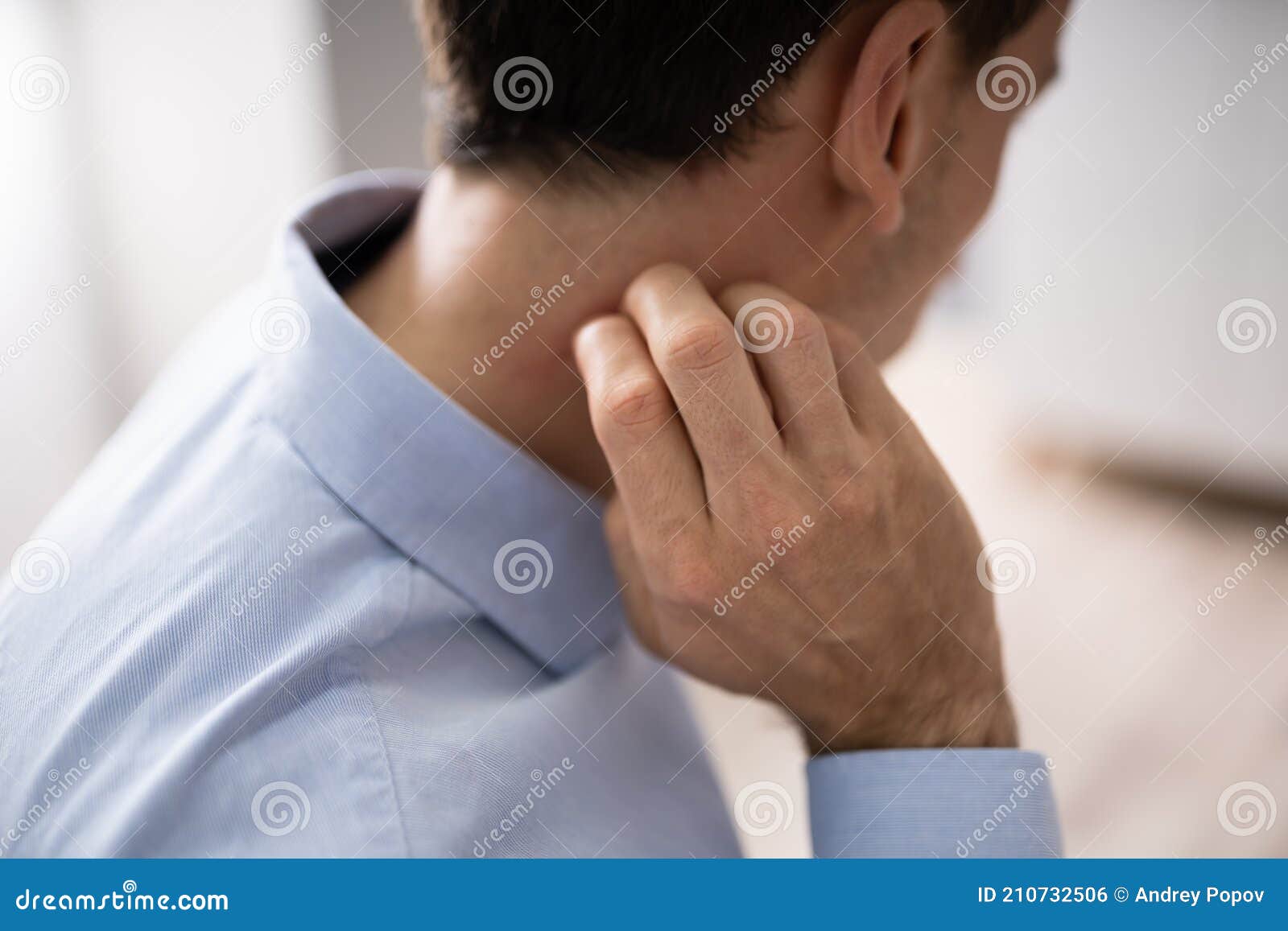 Man Scratching His Neck stock photo. Image of neck, head - 210732506