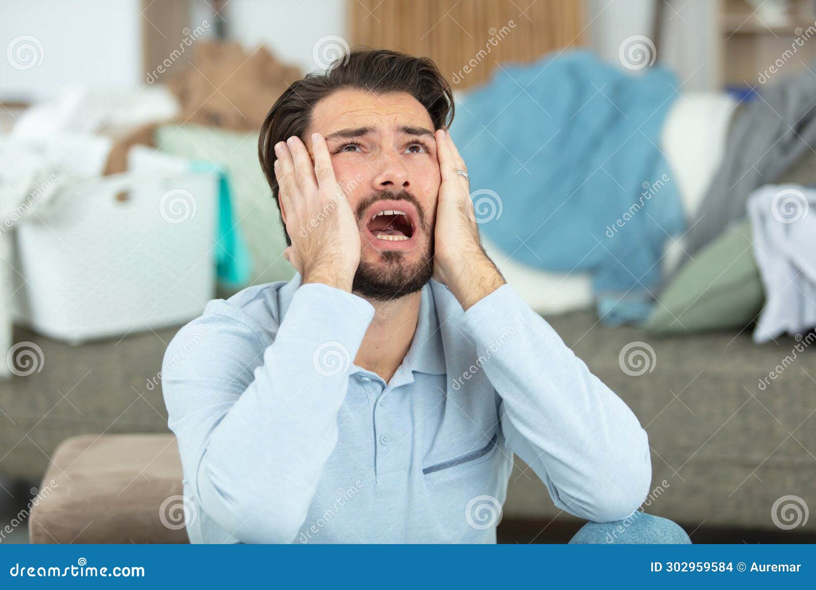 Man Screaming in Despair Surrounded by Laundry Stock Photo - Image of ...