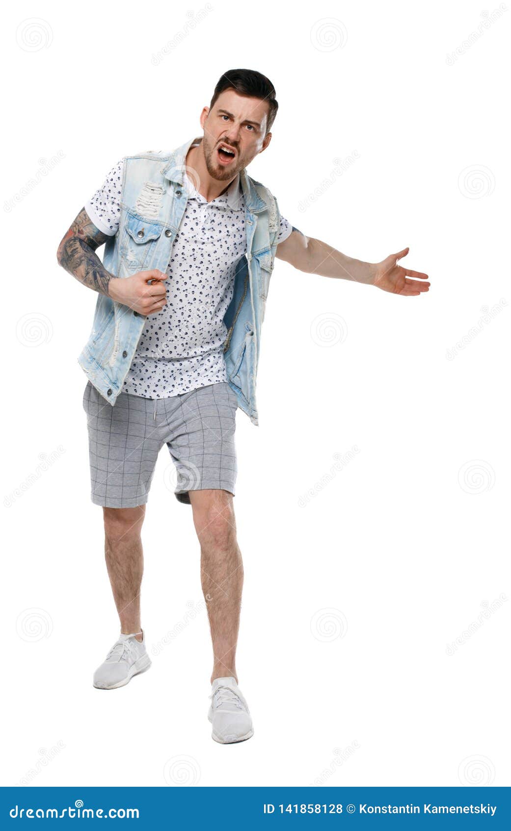 The Man Screams. Aggressive Guy in Tattoos Yelling at the Frame and ...