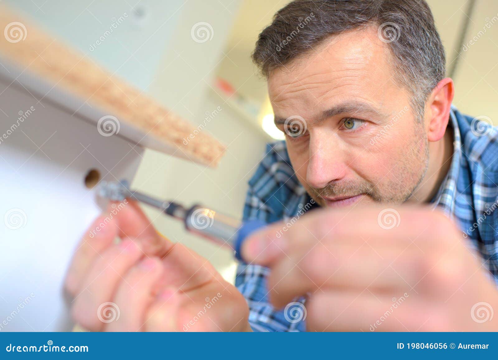Man screwing something stock photo. Image of twist, connect - 198046056