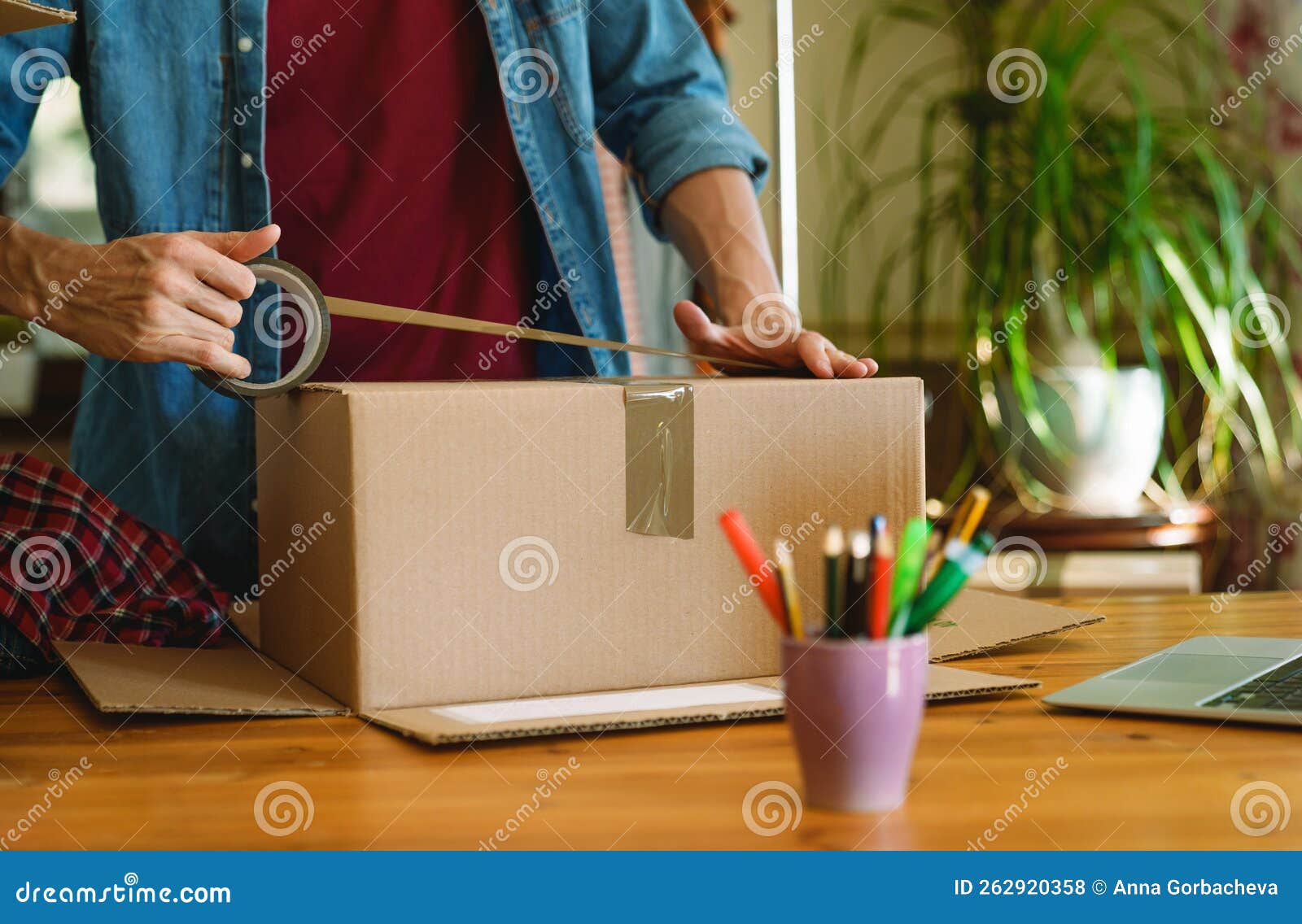 Man Sealing Parcel with Duct Tape Stock Photo - Image of retail, tape ...