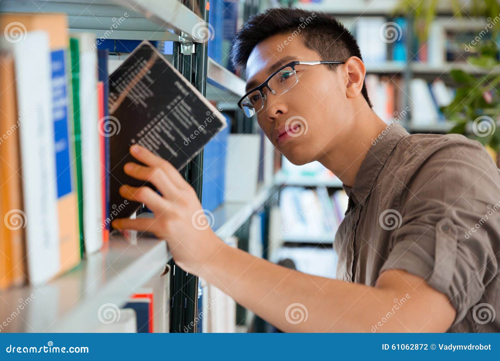 Man Searching Book in Library Stock Photo - Image of education ...
