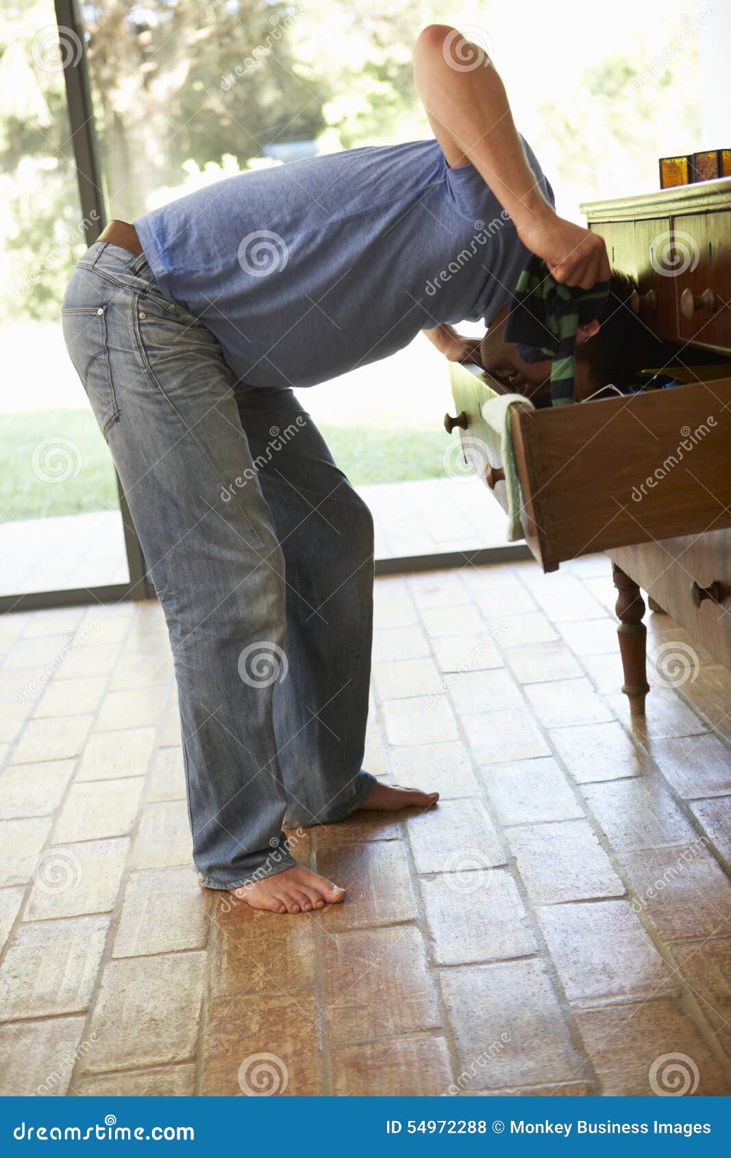 Man Searching for Something in Drawers Stock Photo - Image of caucasian ...