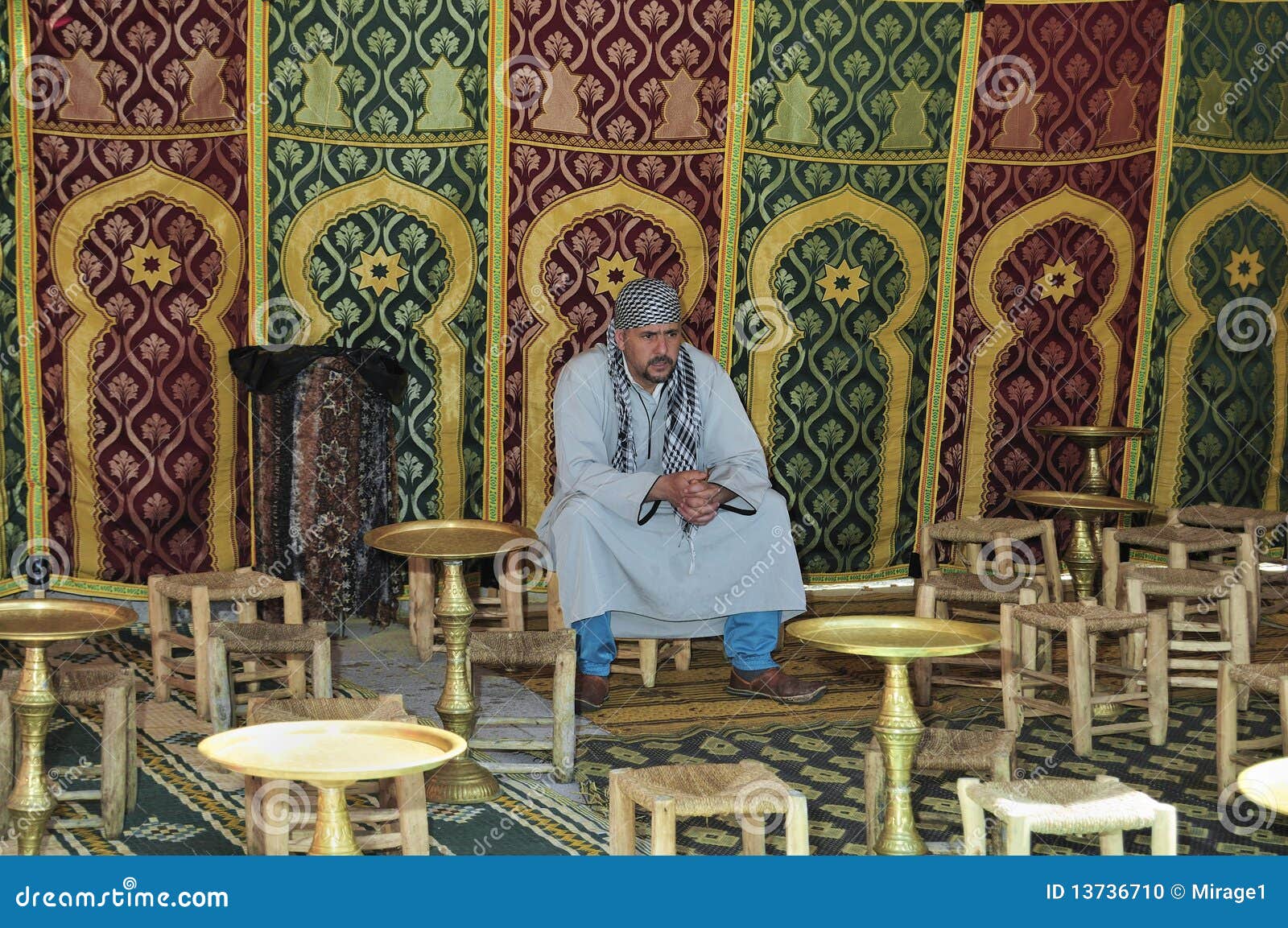 Man Seated in a Khayma stock photo. Image of coffee, wicker - 13736710