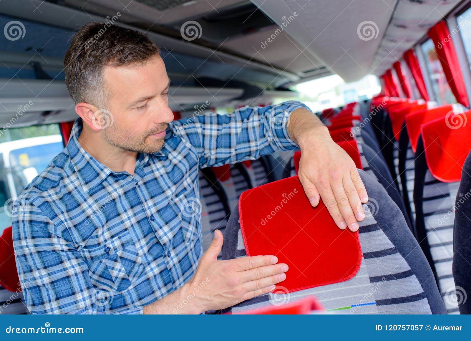 Man Securing Protector To Bus Headrest Stock Image - Image of coach ...