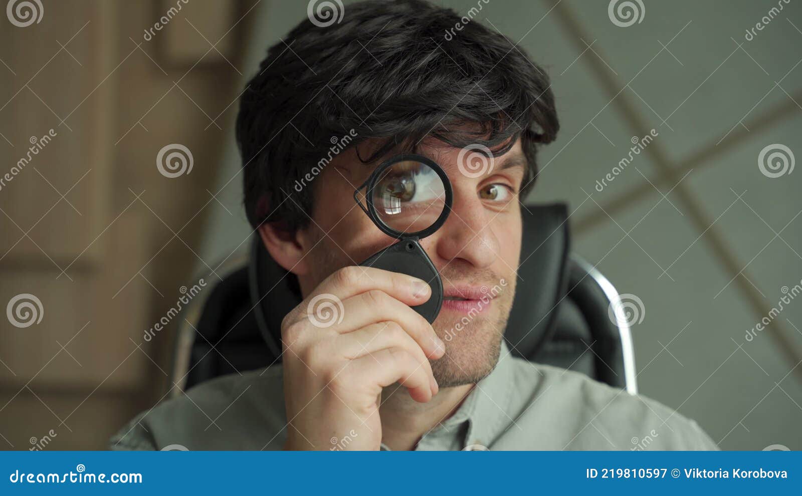 Man See through Magnifying Glass. Male Taking a Magnifying Glass and ...