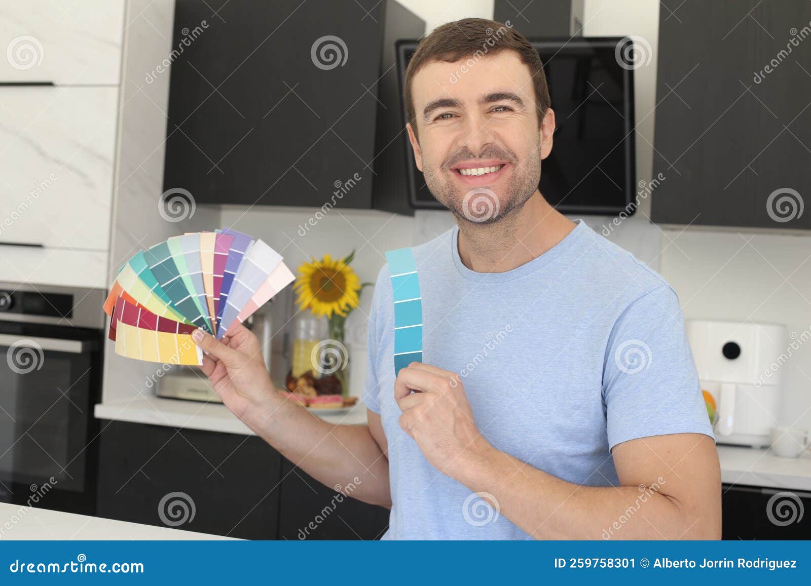 Man Selecting the Right Color for a Home Wall Stock Image - Image of ...