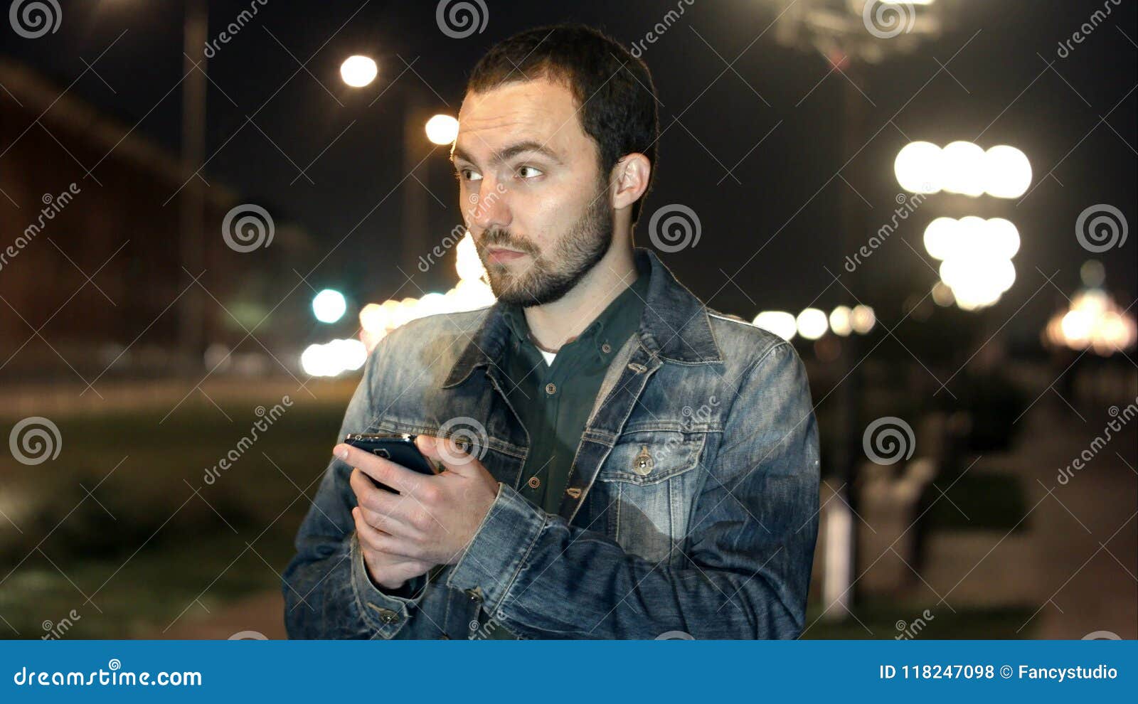 Man Send Text Message by Cell with Confused Expression on Face Stock ...