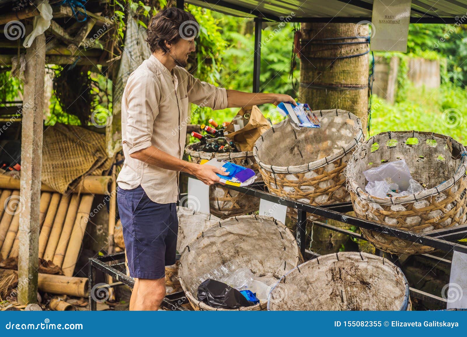 Man Separately Picks Up Trash. Separate Garbage Collection Concept ...
