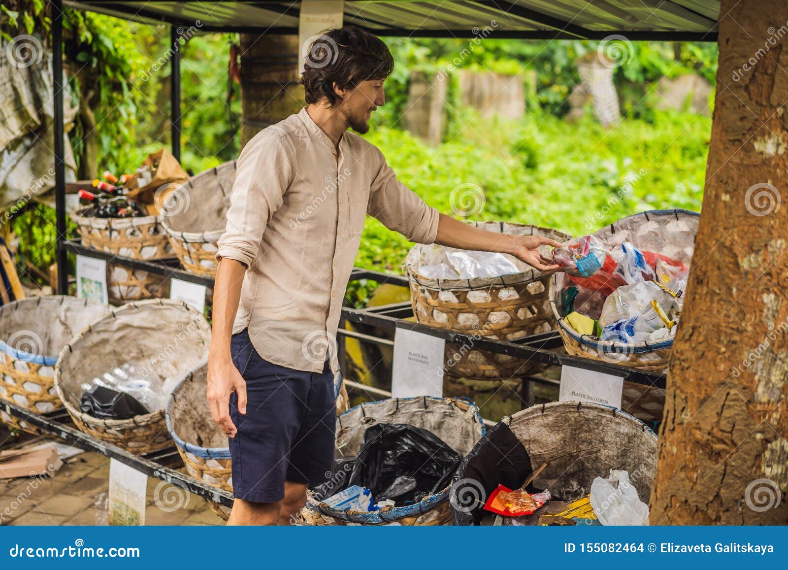 Man Separately Picks Up Trash. Separate Garbage Collection Concept ...
