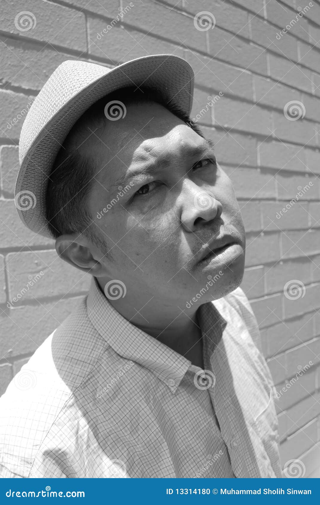Man with a Serious Expression Stock Photo - Image of looking, wall ...