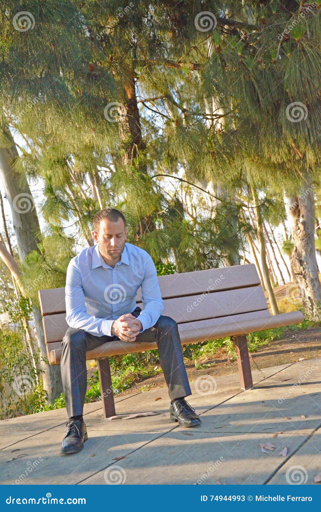 Man in serious prayer. stock image. Image of hands, park - 74944993