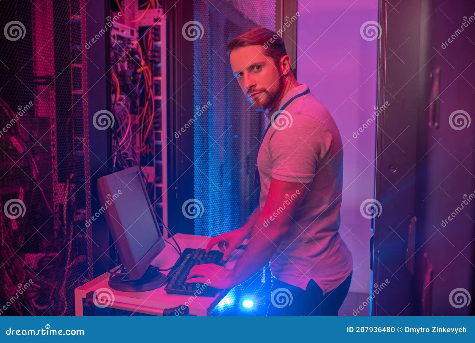 Man in Server Room Working on Computer Stock Photo - Image of focused ...