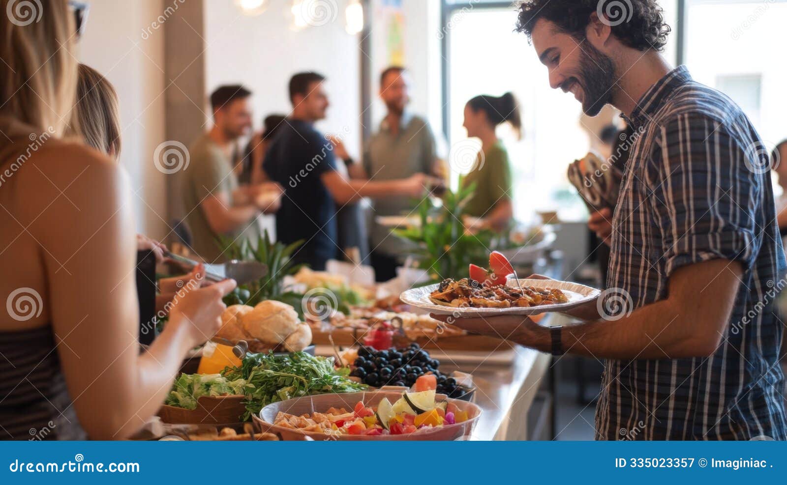 Man Serving Food at Buffet Table with People in Background Stock ...