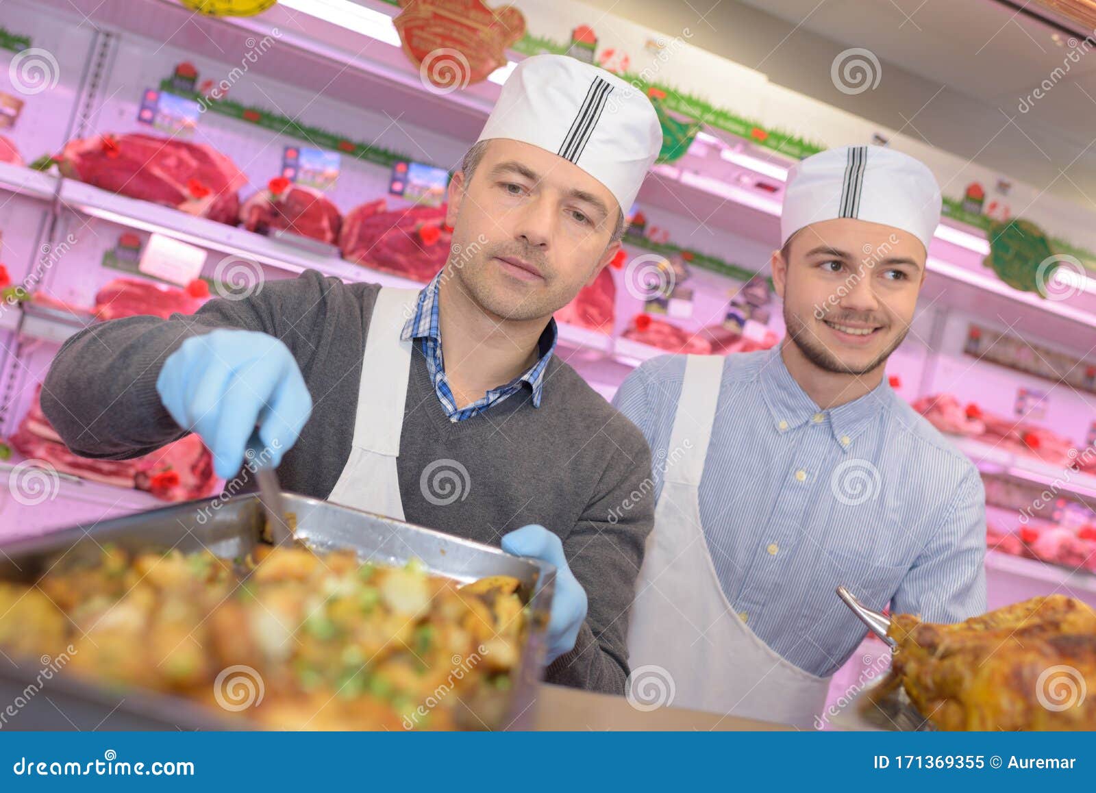 Man serving prepared food stock image. Image of serving - 171369355
