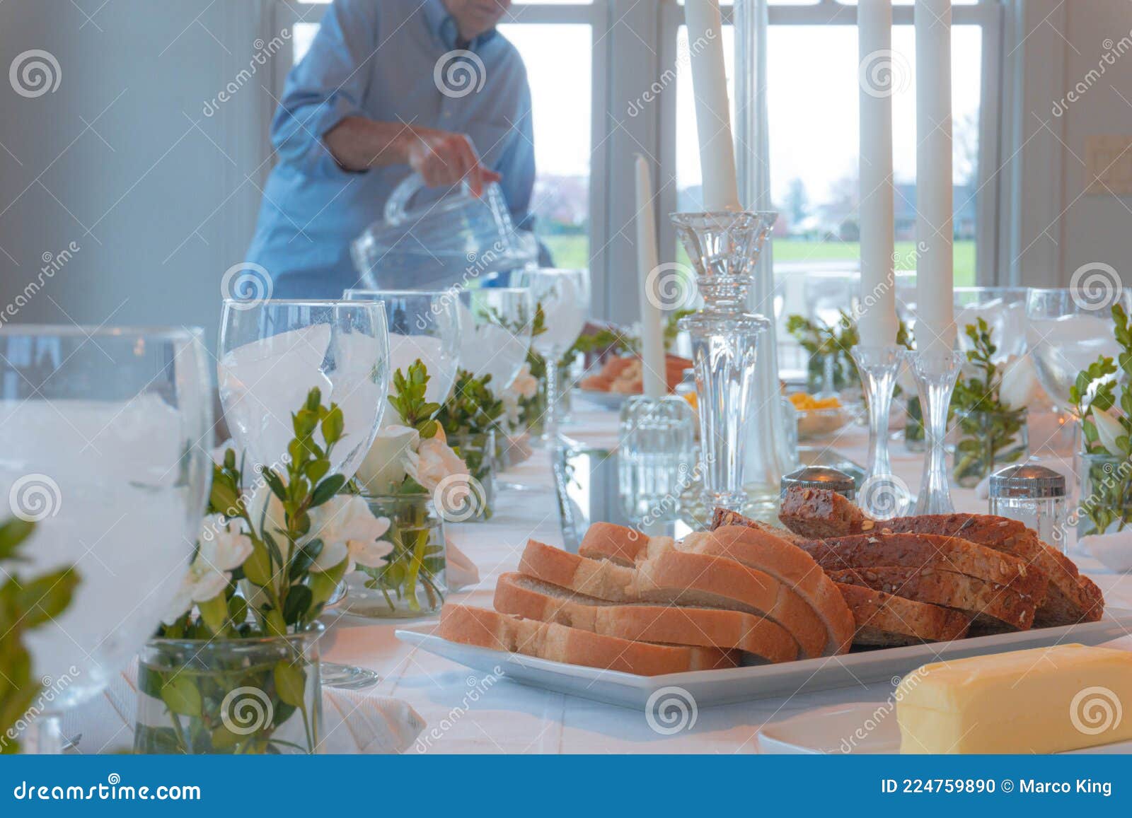Man Serving Water for a Holiday Meal Stock Photo - Image of cranberry ...