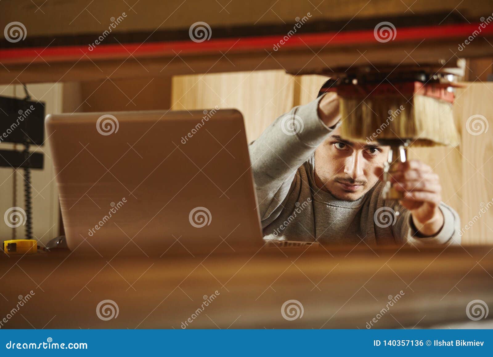 Man Sets the Cutter in Chuck for Cutting Wood. Machine with Computer ...