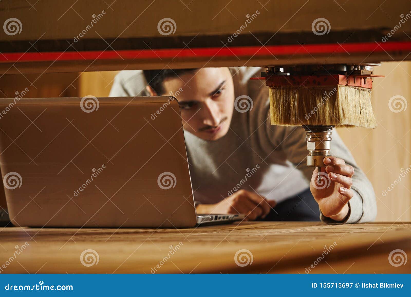 Man Sets the Cutter in Chuck for Cutting Wood. Machine with Computer ...