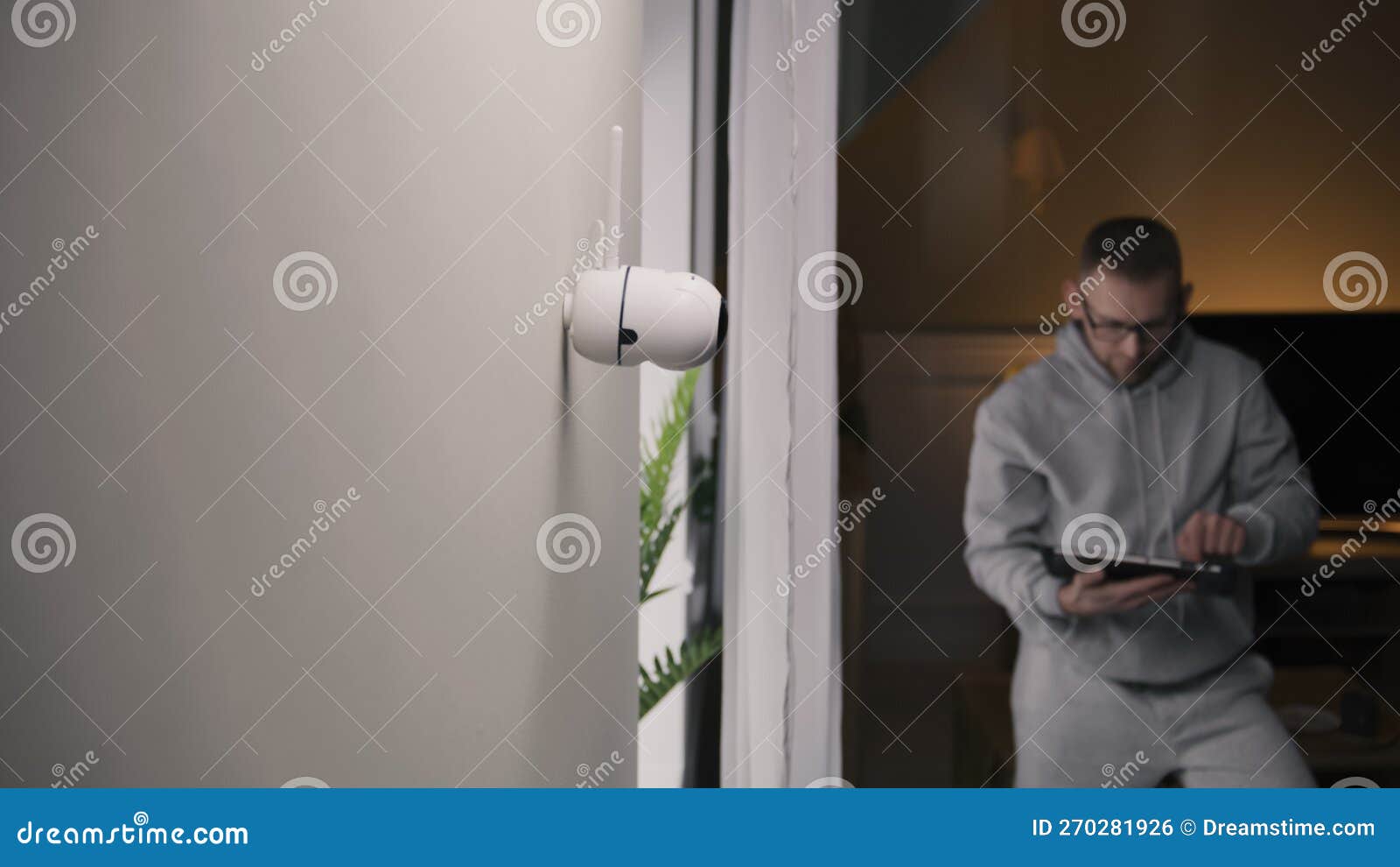 Man Sets Up Security Camera for Night Stock Photo - Image of camera ...