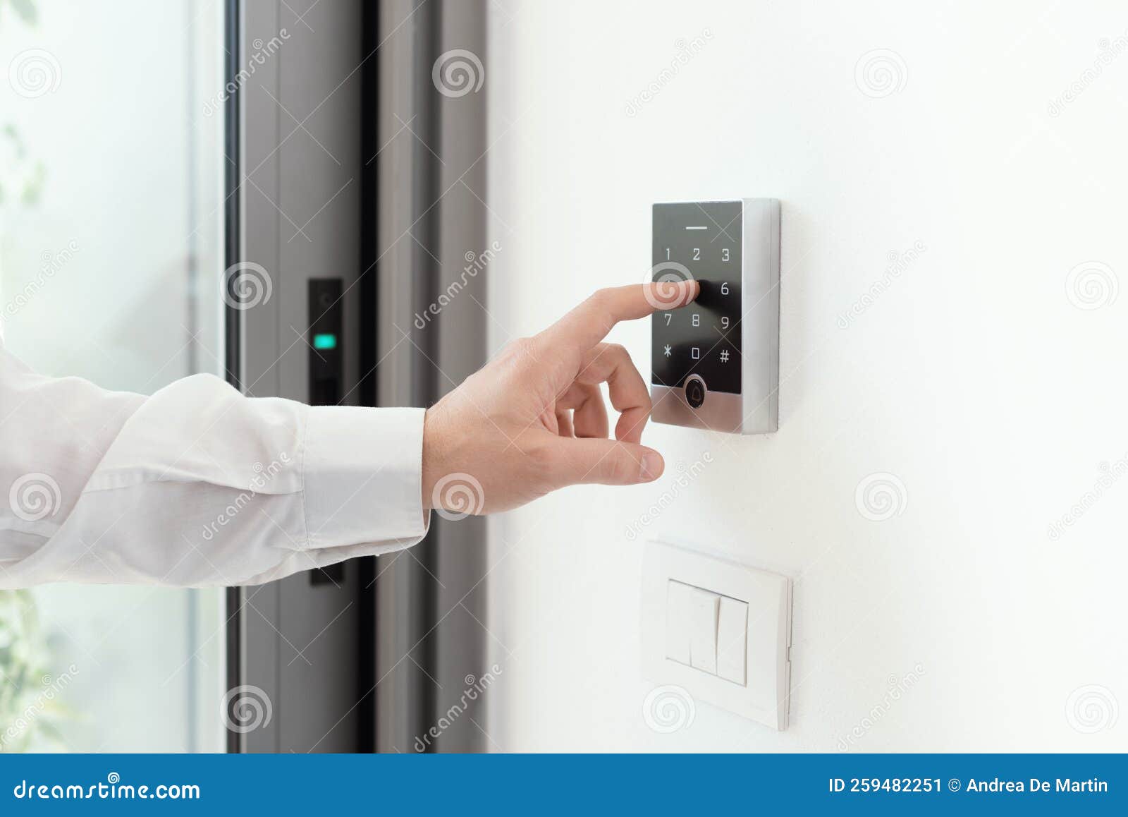 Man Setting an Alarm Code for Home Security Stock Image - Image of ...