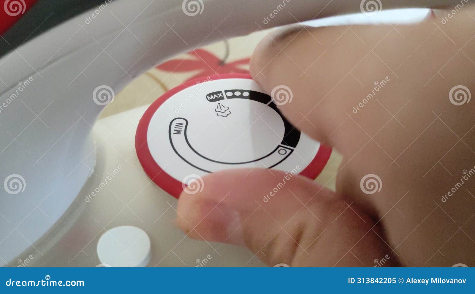 Man Setting Ironing Temperature. Electrical Iron Temperature Controler ...