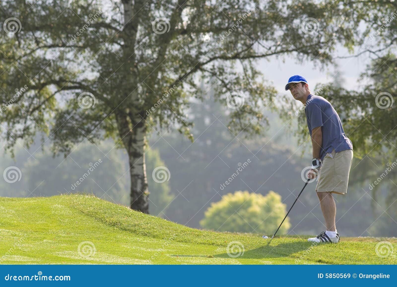 Man Setting Up Golf Shot - Horizontal Stock Image - Image of calm ...