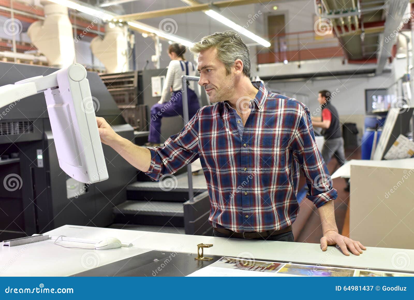 Man Setting Up a Printing Machine Stock Image - Image of editing, desk ...