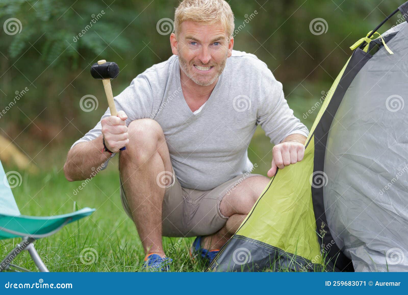 Man setting up tent stock image. Image of nature, adult - 259683071