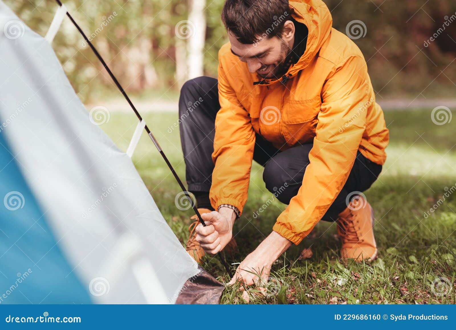 Man Setting Up Tent Outdoors Stock Photo - Image of tourist, young ...