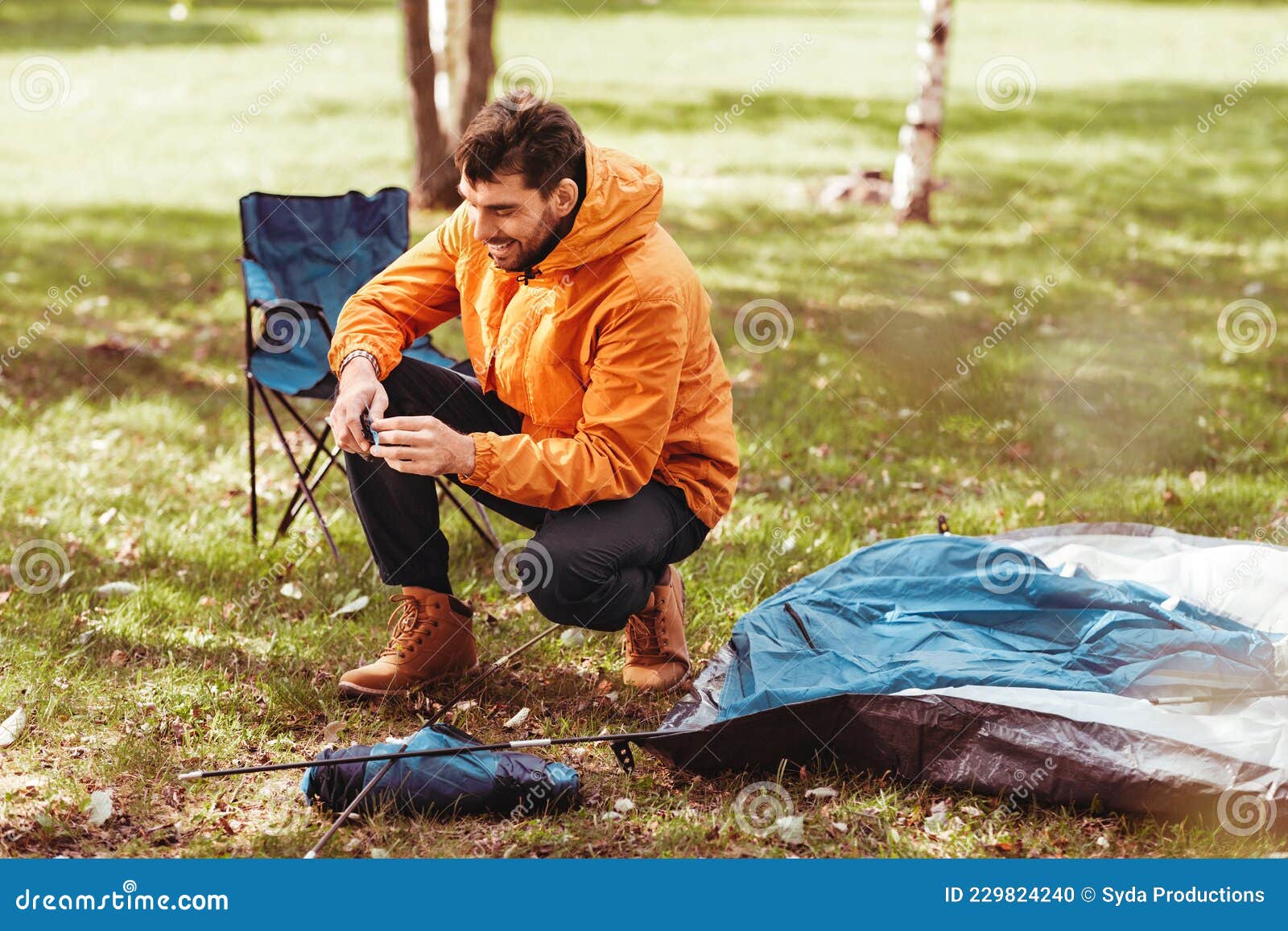Man Setting Up Tent Outdoors Stock Photo - Image of assembling, camper ...