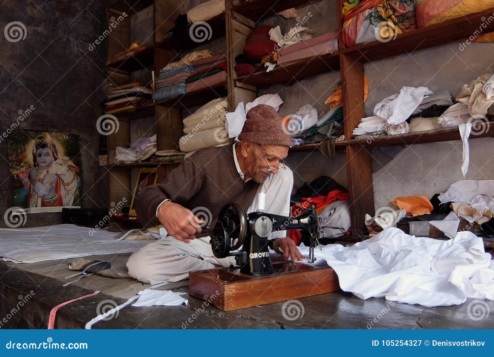 Man Sew Clothes on Sewing Machine in His Workshop. Editorial ...