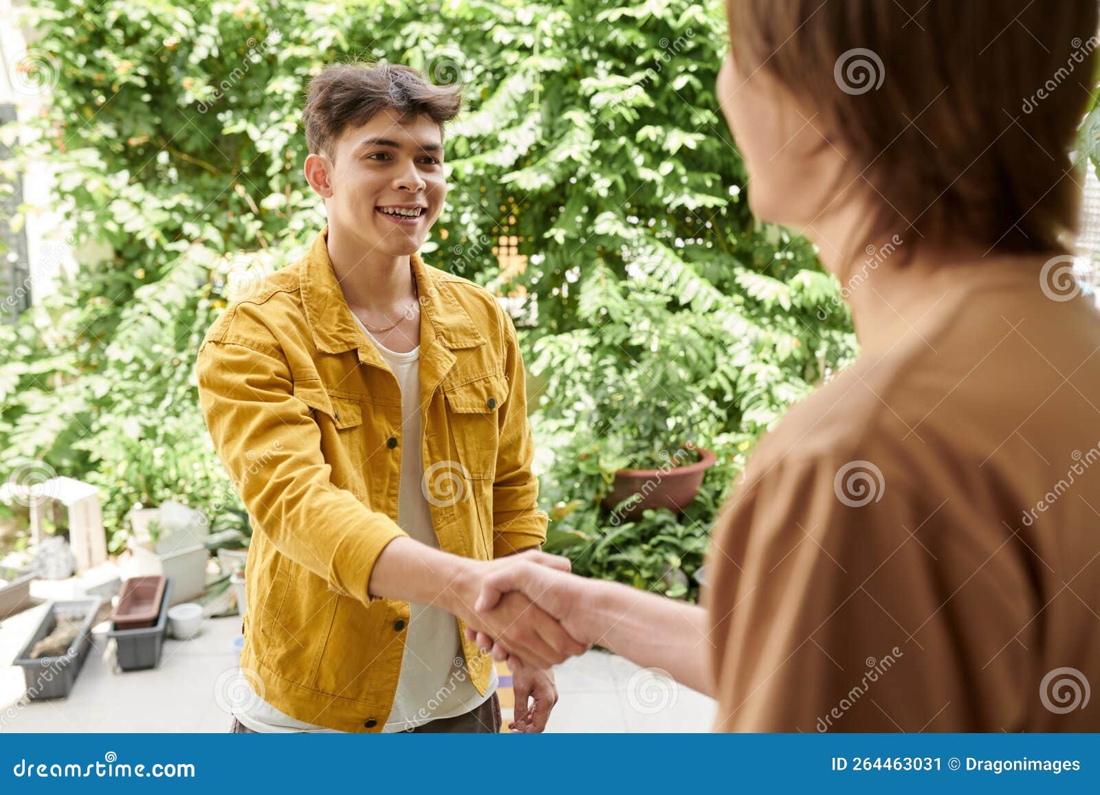 Man Shaking Hand of Buddy stock image. Image of dorm - 264463031