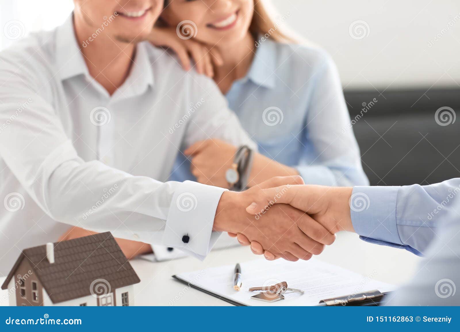 Man Shaking Hands with Real Estate Agent in Office Stock Image - Image ...