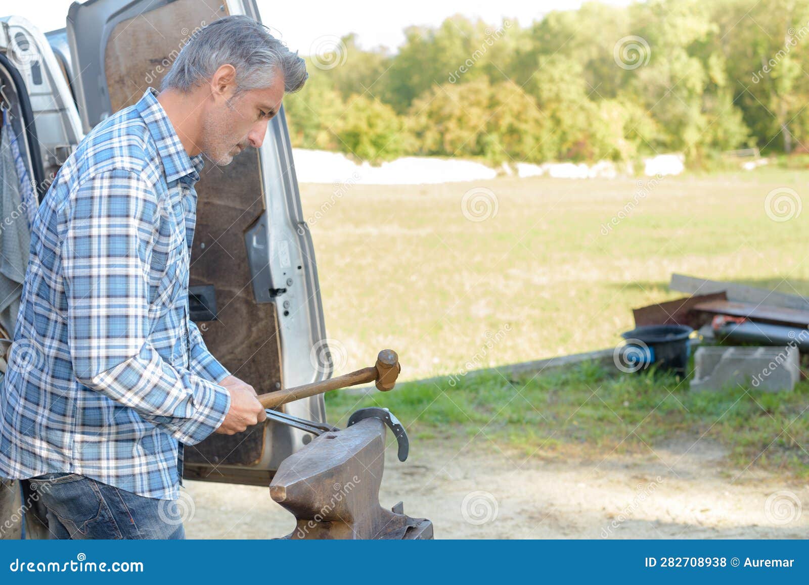 Man shaping horseshoe stock photo. Image of manual, tool - 282708938