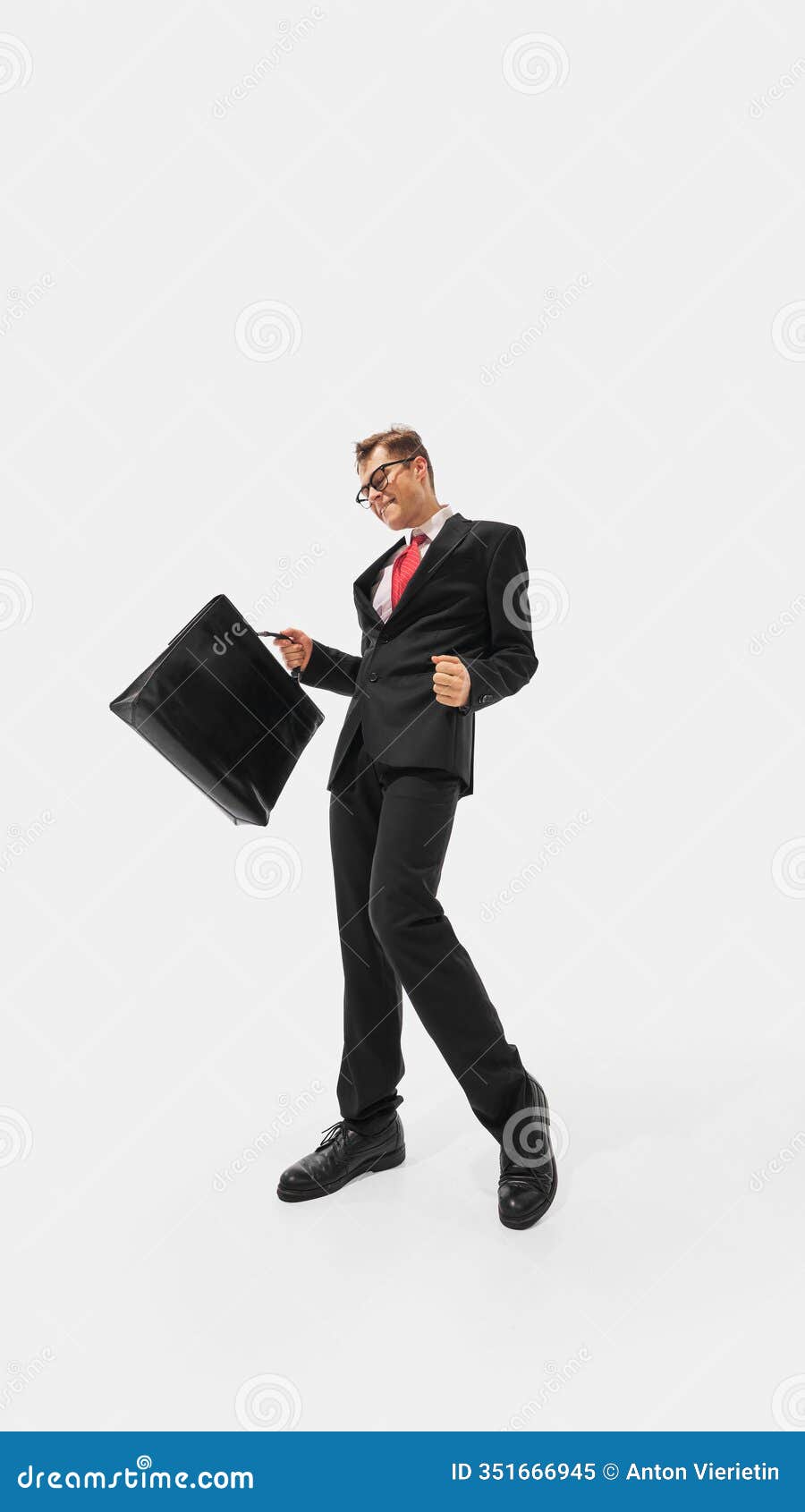 Man in Sharp Black Suit and Red Tie Striking Exaggerated Confident Pose ...