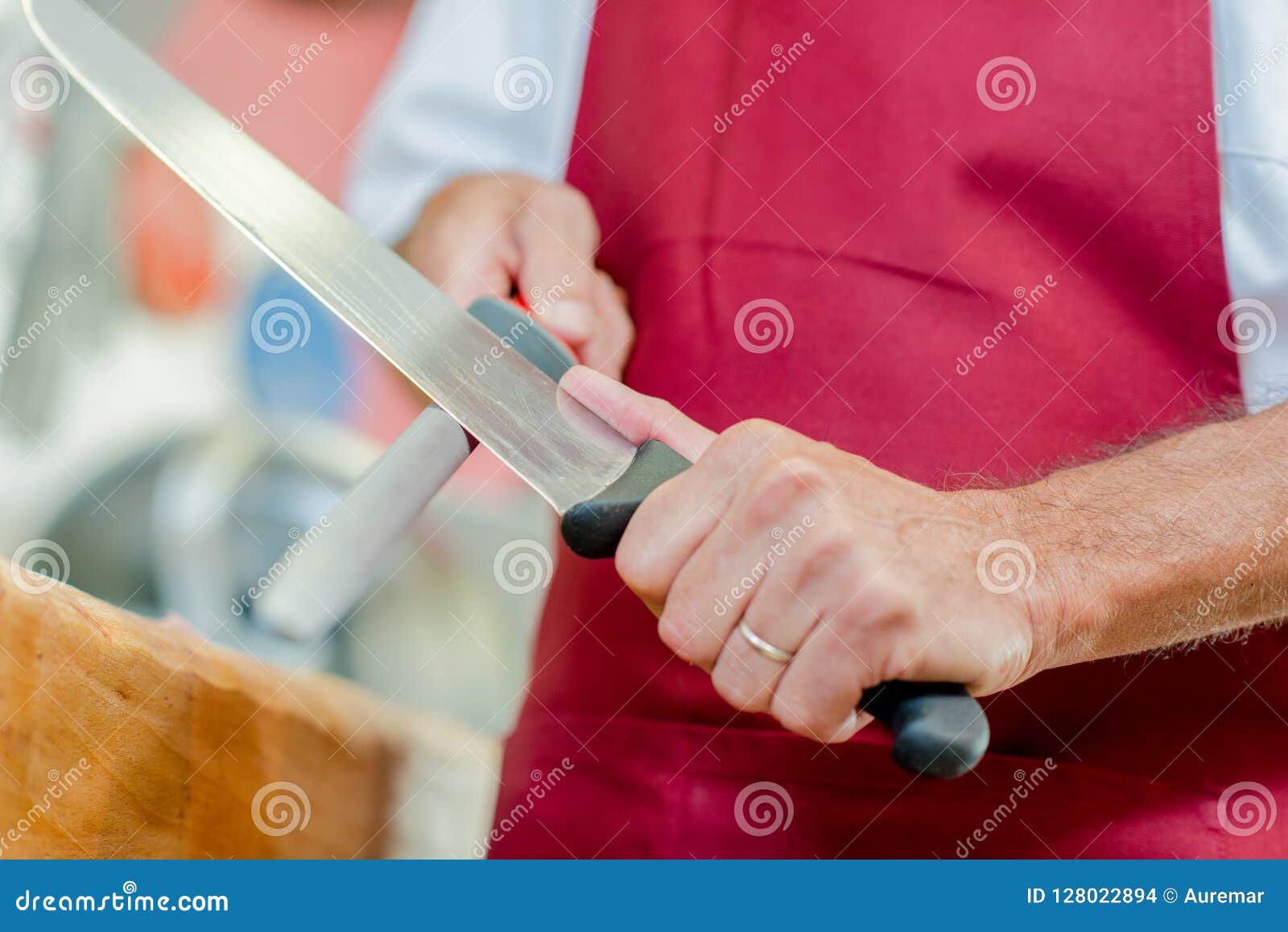 Man sharpening a knife stock photo. Image of skinner - 128022894