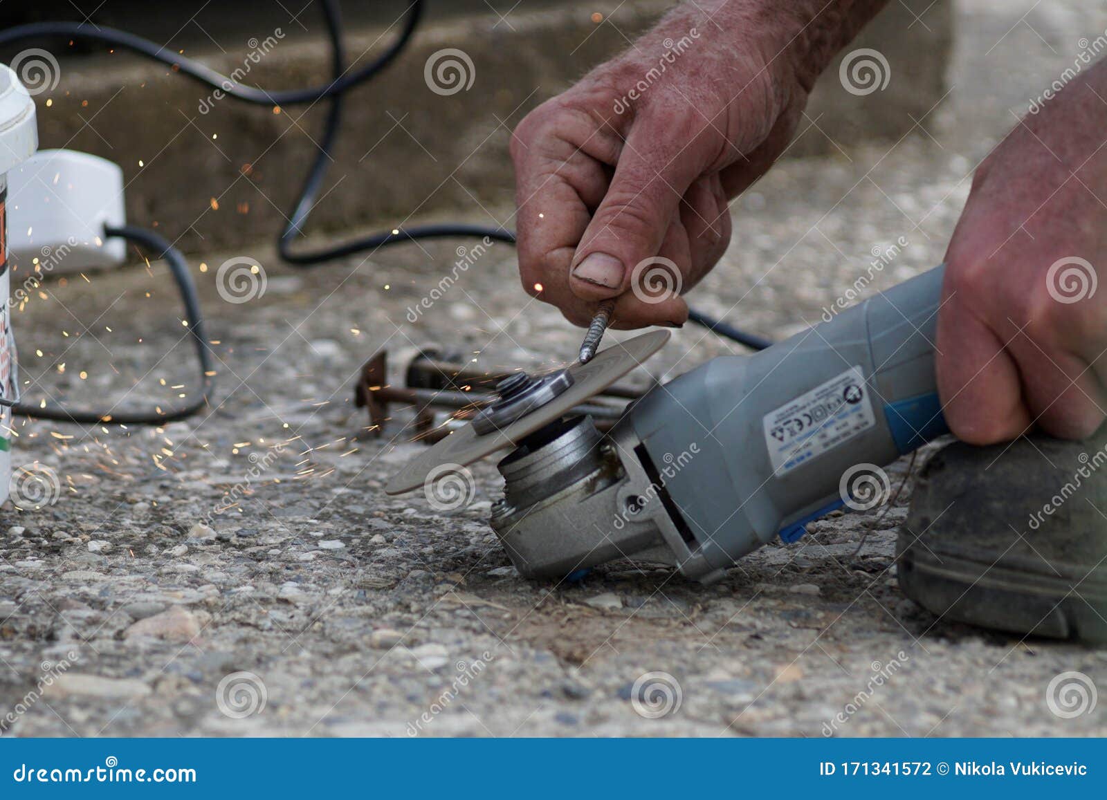 Man Sharpening Nail on the Grinding Machine Stock Photo - Image of ...