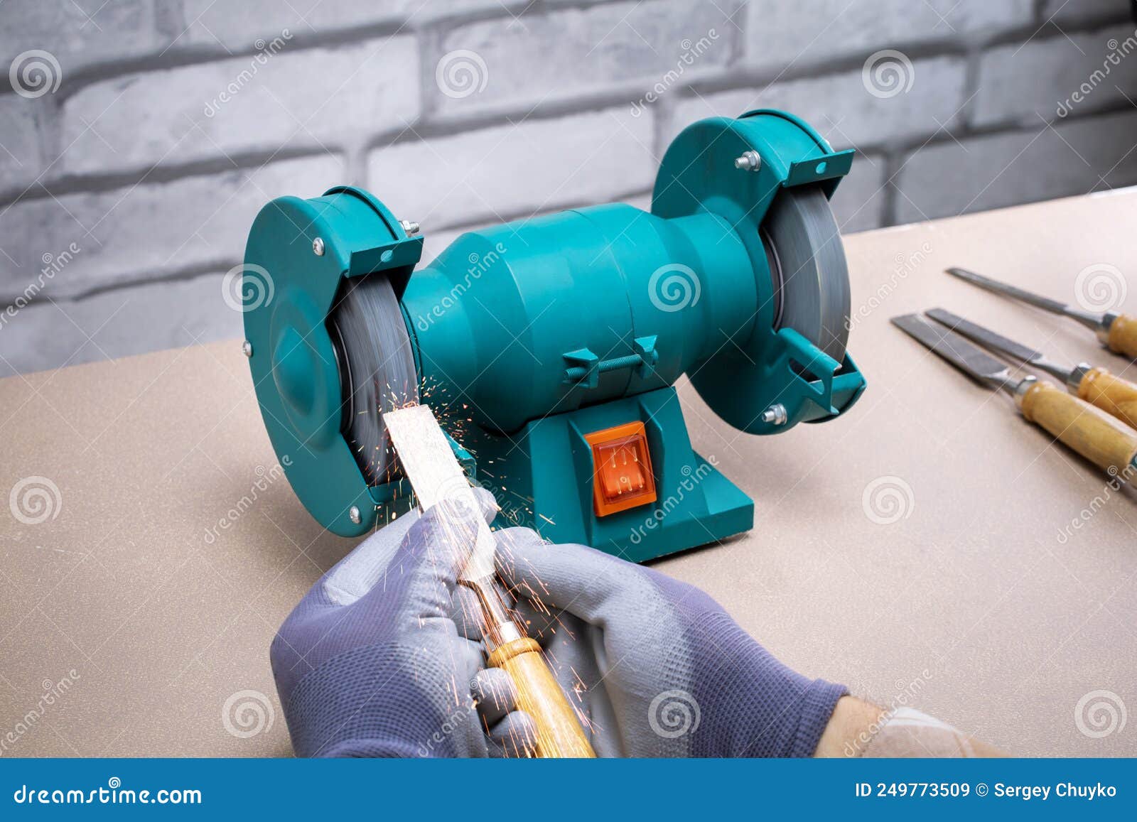 Man Sharpening Work Tool, Chisel on Grinder in Workshop. Stock Image ...