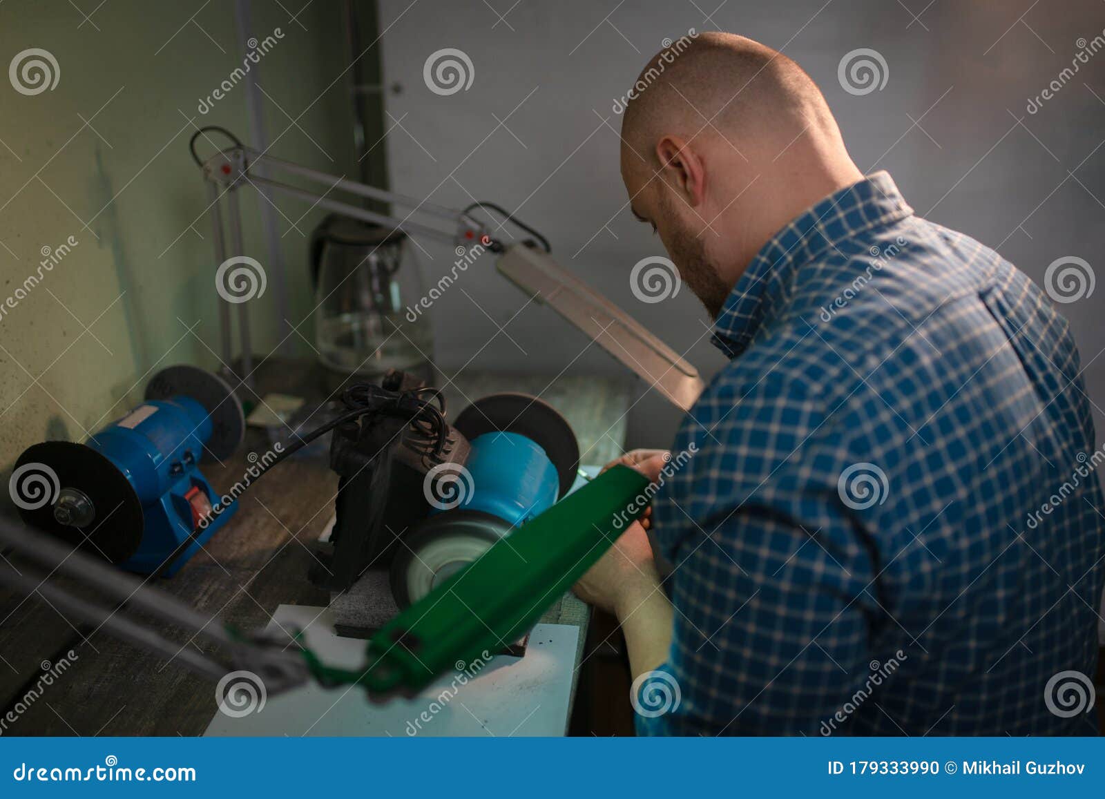 Master Sharpens Scissors on Special Equipment for Sharpening Tool Stock ...