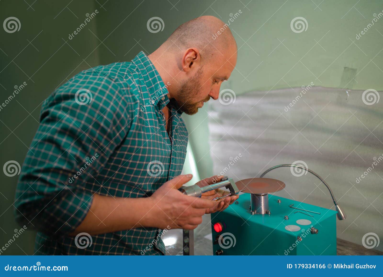 Master Sharpens Scissors on Special Equipment for Sharpening Tool Stock ...