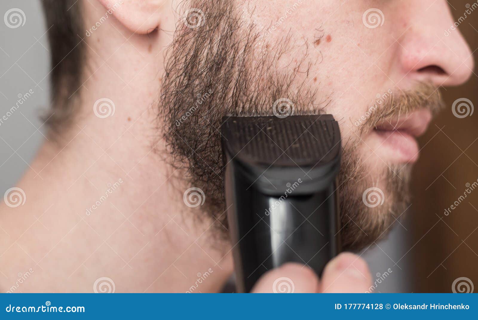 Man Shaves His Beard with an Electric Razor Stock Photo - Image of hair ...