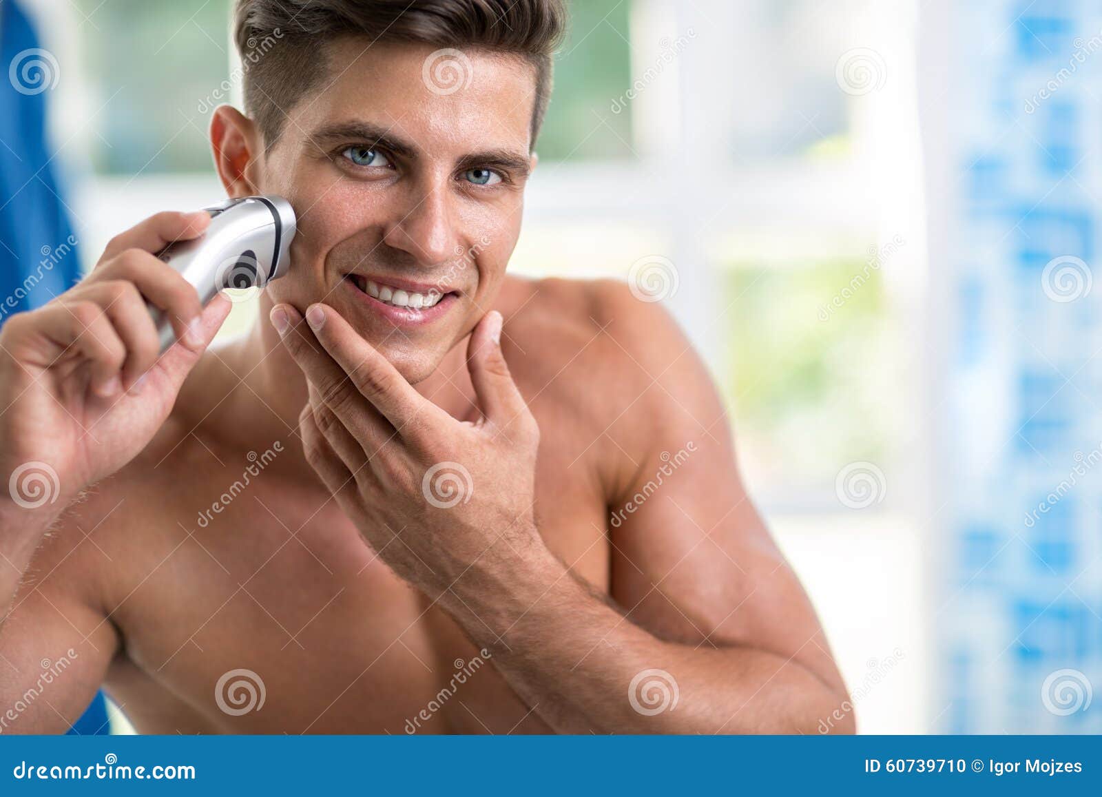 Man Shaving Face with Electric Razor Stock Photo - Image of cheek ...